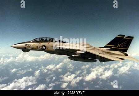 A Fighter Squadron 32 (VF-32) F-14A Tomcat aircraft is lowered from the ...