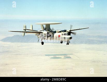 An air-to-air right front view of an E-2C Hawkeye aircraft from Carrier ...