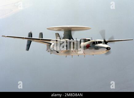 An air-to-air right front view of an E-2C Hawkeye aircraft from Carrier ...