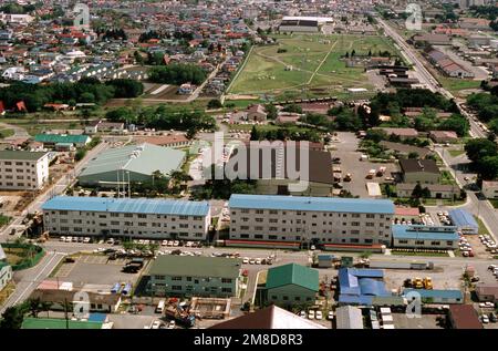 An aerial view of a portion of the base and the surrounding city of ...