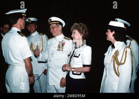 Admiral (ADM) Leon A. Edney and his wife are congratulated at the ...