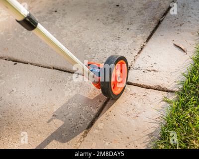 Measuring wheel tool for calculating distance. Outdoor surveying ...