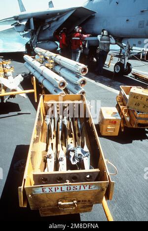 Aviation ordnancemen from Fighter Squadron 21 (VF-21) use a linkless ...
