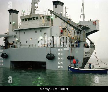 Crewmen aboard the Dutch heavy lift ship SUPER SERVANT 3 stand by as ...