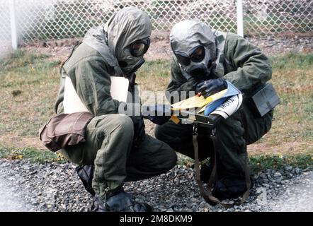 Medical personnel wearing nuclear-biological- chemical (NBC protective ...