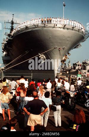 Crew members man the rail aboard the first Aegis guided missile cruiser ...