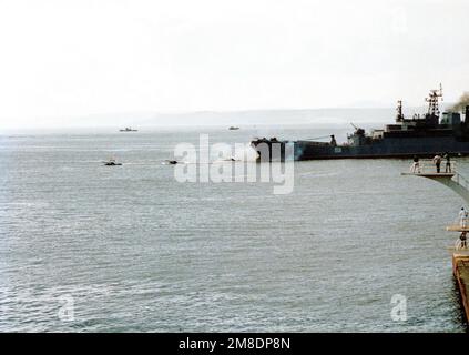 Soviet Naval Infantry PT-76 amphibious tanks emerge from the bow of a ...