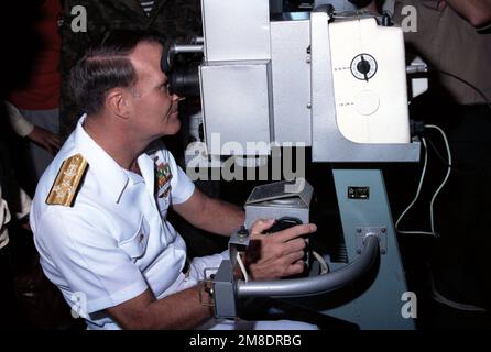 Admiral Charles R. Larson, Commander in CHIEF, US Pacific Fleet, sits ...
