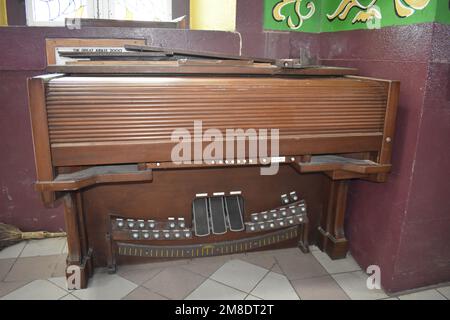The console of a pipe organ, with pistons and combination action ...
