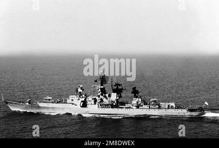A port beam view of a Soviet Kresta II-class cruiser lying at anchor ...