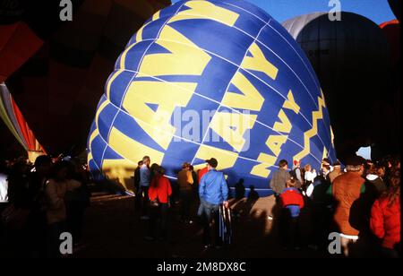 Onlookers gather around a U.S. Navy hot air balloon as a second Navy ...