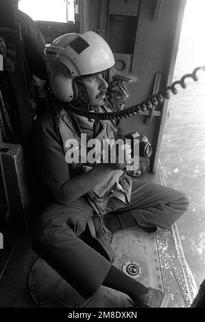 A member of Helicopter Light Anti-submarine Squadron 94 (HSL 94 ...