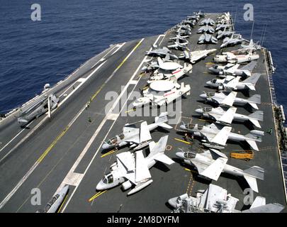Various aircraft line the flight deck of the nuclear-powered aircraft ...