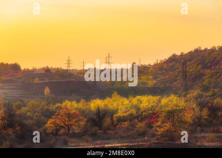 Ukrainian bright autumn landscape highlighted by sun. Rural scenery at ...