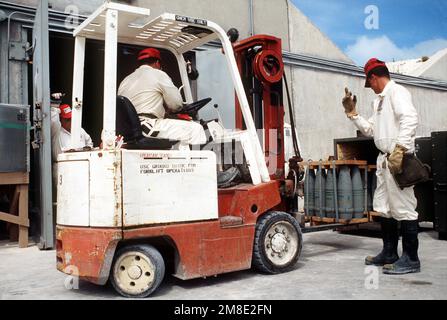 A pallet of 155mm chemical artillery shells sits in its shipping crate ...