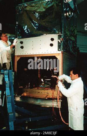 Technicians at the Naval Research Laboratory (NRL), work on the Low ...