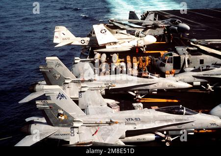 An A-6E Intruder aircraft armed with AIM-7 Sparrow missiles stands on ...