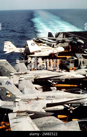 An A-6E Intruder aircraft armed with AIM-7 Sparrow missiles stands on ...