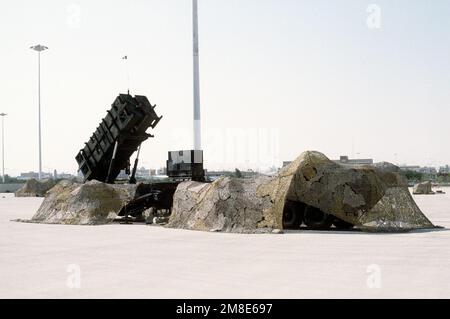 A partially camouflaged M-109 launching station for the MIM-104 Patriot ...
