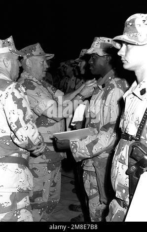 GEN. Alfred M. Gray, commandant of the Marine Corps, passes through the ...