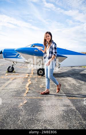 Young BIPOC Female Pilot doing preflight check on small plane Stock ...