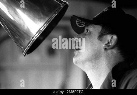 A crew member aboard the ocean minesweeper USS IMPERVIOUS (MSO-449 ...