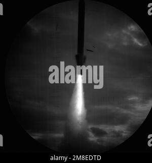As seen through the submarine's periscope, a BGM-109 Tomahawk land ...