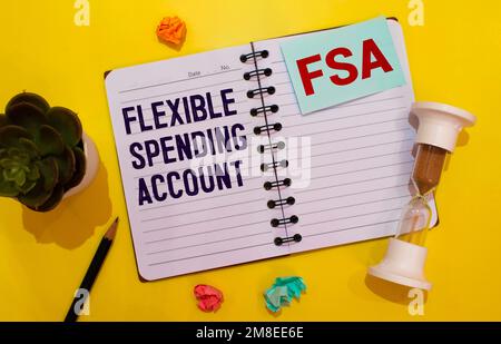 Papers with flexible spending account FSA on a table, business concept ...