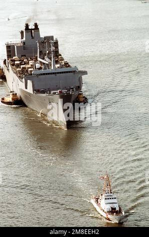 Harbor tugs maneuver the vehicle cargo ship PFC. EUGENE A. OBREGON (T ...