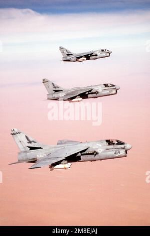 Three Attack Squadron 72 (VA-72) A-7E Corsair aircraft cruise above the ...