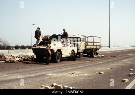American servicemen examine an Iraqi BRDM-2 amphibious scout car ...