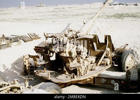 An Iraqi S-60 57mm automatic anti-aircraft gun sits in its emplacement ...