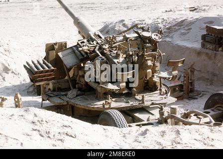 An Iraqi S-60 57mm automatic anti-aircraft gun sits in its emplacement ...
