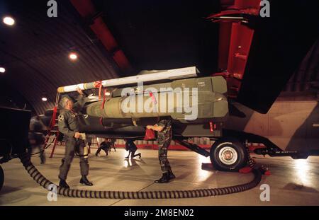 Ground crew members conduct preflight checks of Sea Harrier FRS. Mark 1 ...