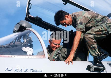 COL. Rick N. Parsons, commander, 33rd Tactical Fighter Wing, checks his ...