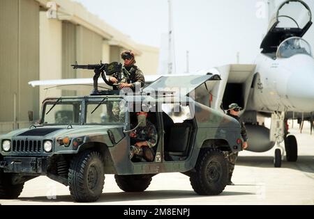 An Air Force security policeman mans an M-60 machine gun mounted on the ...