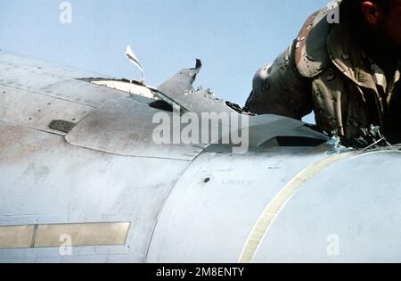 A view of the damage to the fuselage of an F/A-18 strike fighter ...