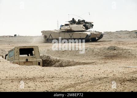 A Marine Corps M-1A1 Abrams main battle tank equipped with a mine ...