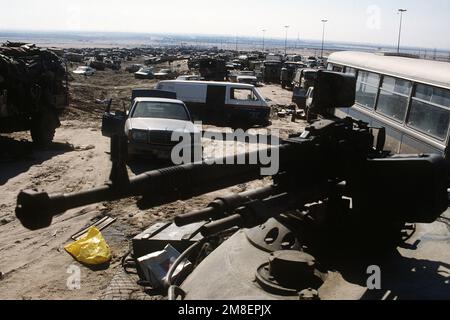 Abandoned cars and trucks clog the road leading out of Kuwait City ...