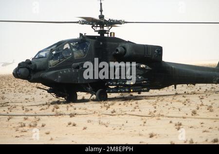 An AH-64A Apache anti-tank helicopter of the XVIII Airborne Corps ...
