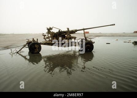 An Iraqi S-60 57mm automatic anti-aircraft gun sits in its emplacement ...