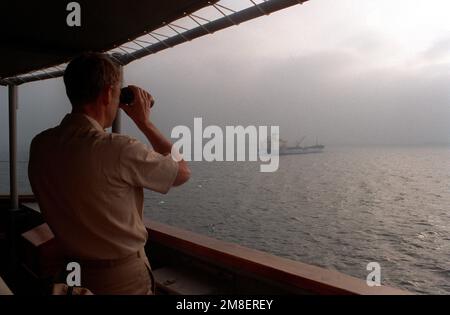 CAPT. Douglas C. Bauer, a Navy combat artist/historian, observes ...