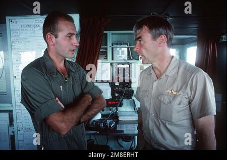 CAPT. Douglas C. Bauer, a Naval historian, speaks with the ship's ...