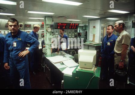 CAPT. Douglas C. Bauer, a Naval historian, speaks with the ship's ...