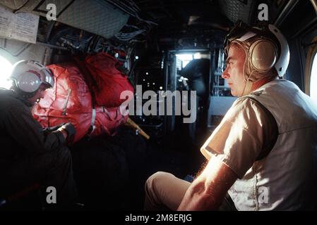 CAPT. Douglas C. Bauer, a Naval historian, speaks with the ship's ...