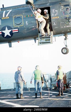 CAPT. Douglas C. Bauer, a Naval historian, speaks with the ship's ...