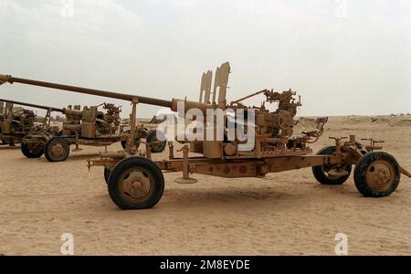 An Iraqi S-60 57mm automatic anti-aircraft gun sits in its emplacement ...
