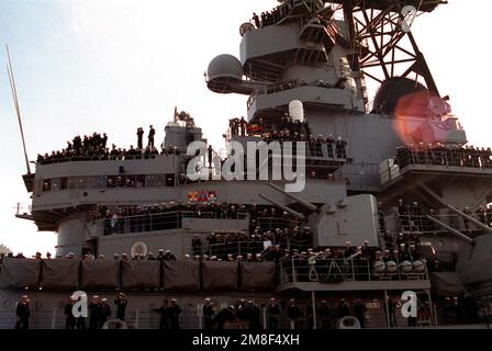 Crew members line the rails of the battleship USS WISCONSIN (BB-64 ...