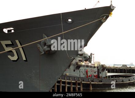 The large harbor tug ANOKA (YTB-810) maneuvers the guided missile ...