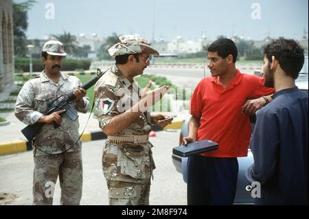 A member of the Kuwaiti police force, armed with an M-16A2 rifle ...